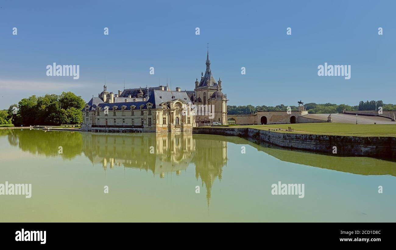 Castle of chantilly, france, on a sunny day with clear blue sky ...