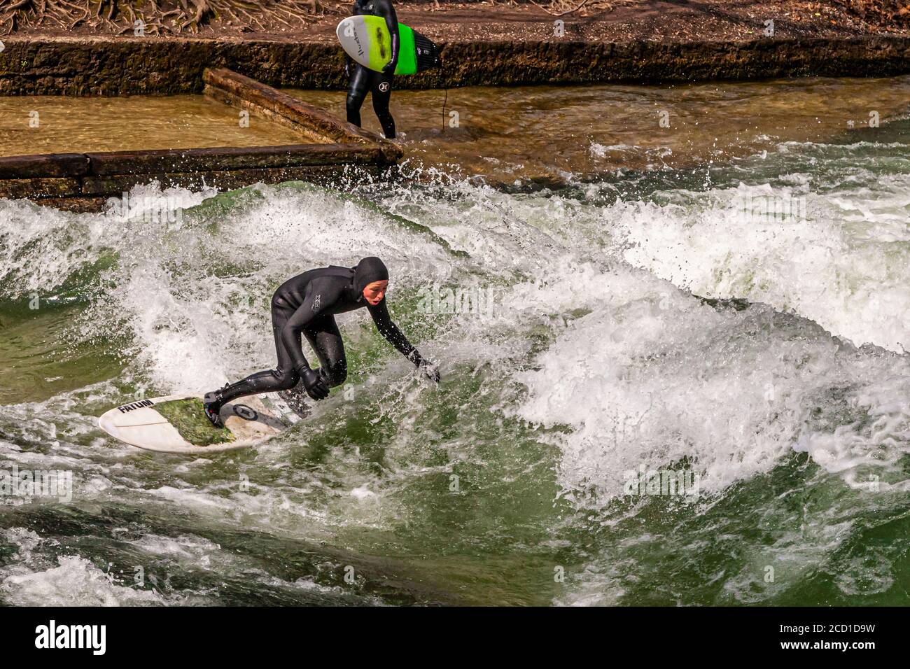 River-Surfing on the Eisbach in Munich, Germany. The standing wave can ...