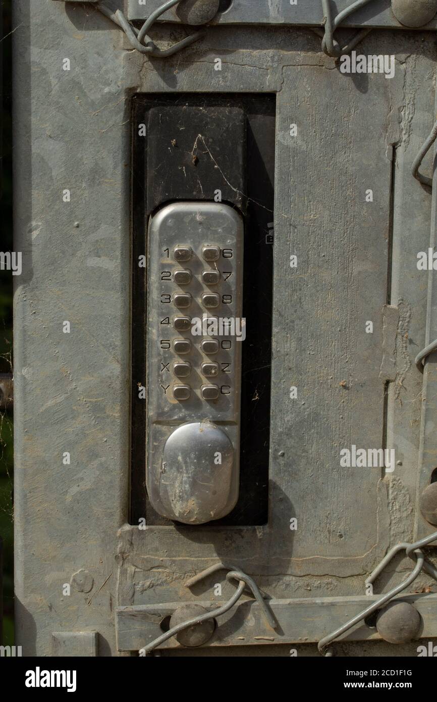 Silver Keypad lock in industrial metal door Stock Photo - Alamy
