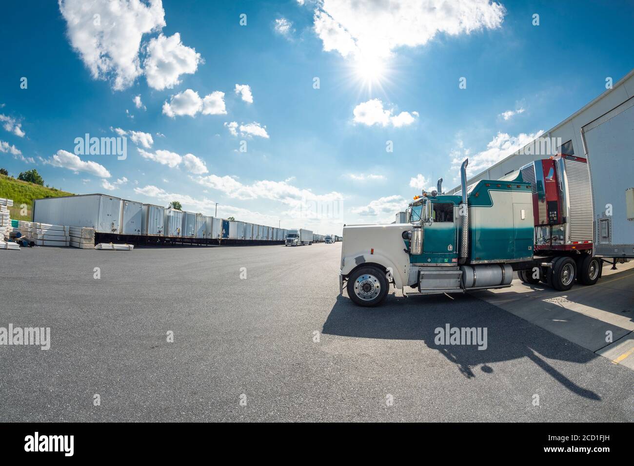 Warehouse loading docks with trucks Stock Photo - Alamy