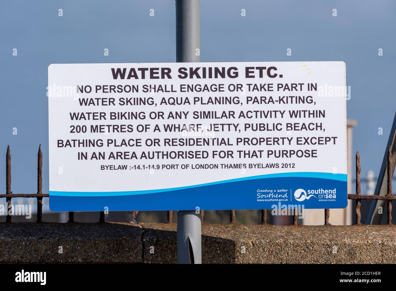 Warning sign for water sports to avoid wharf, jetty, public beach ...