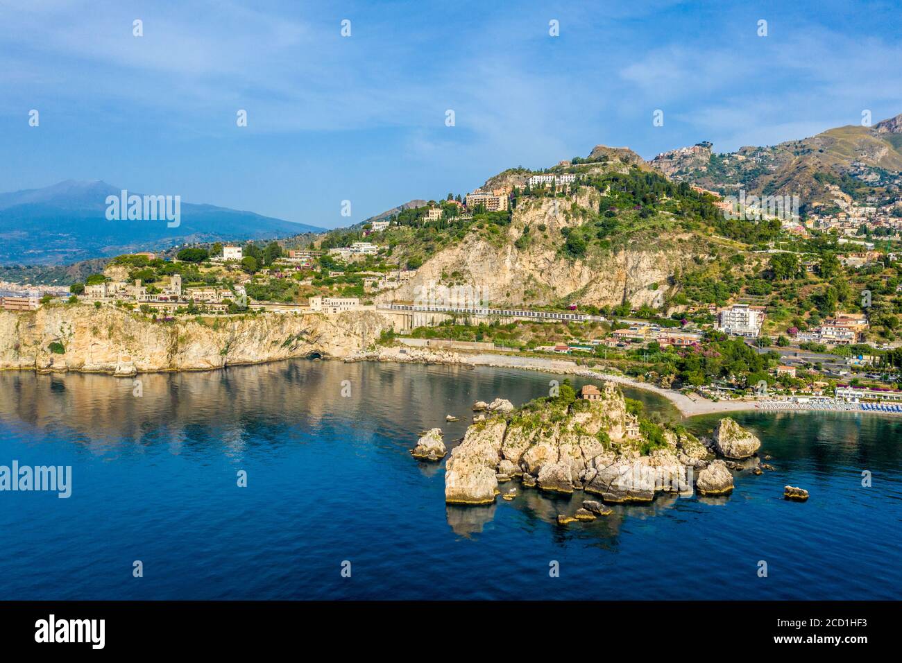 Aerial panoramic view of the town of Taormina, Isola Bella island ...