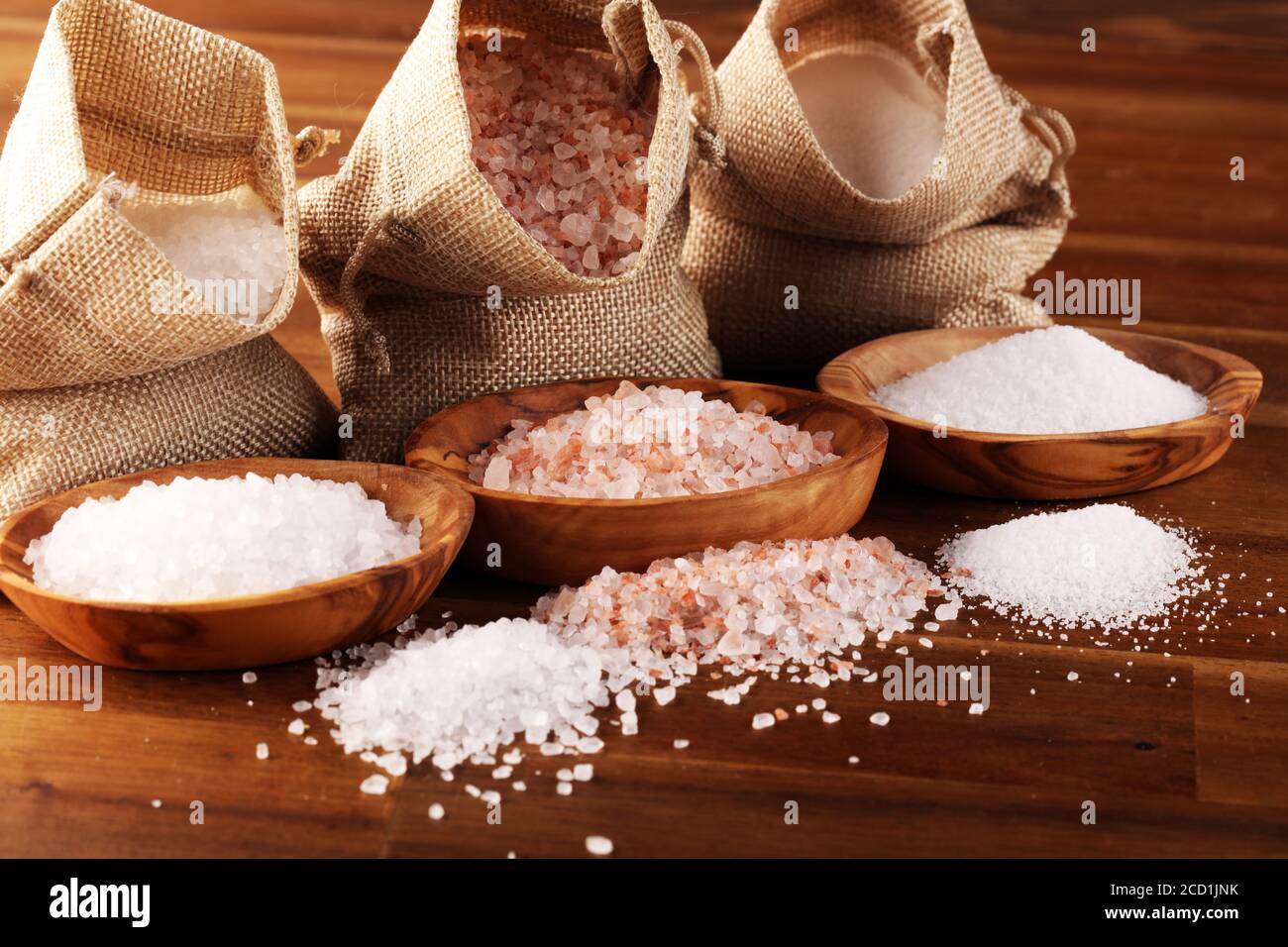 Sea salt and himalayan salt. Crystals of salt on rustic table Stock ...