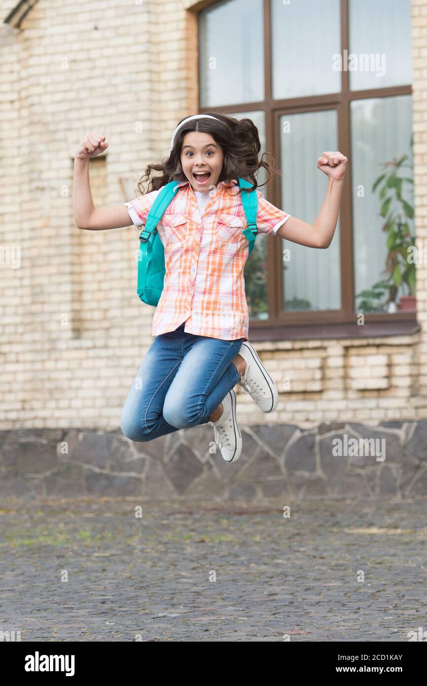 Aim high, together we will fly. Happy child jump outdoors. Active ...