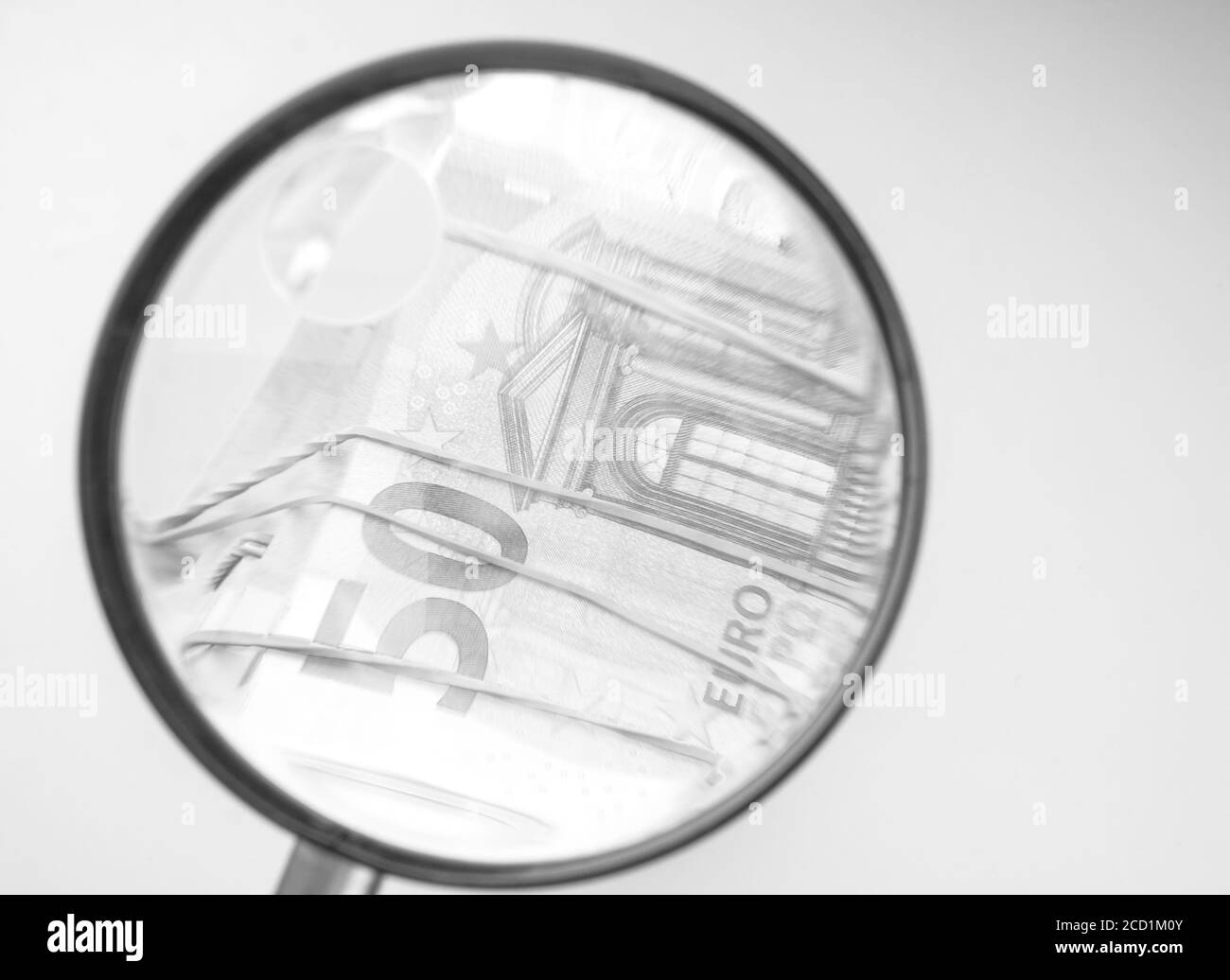 magnifying glass on 50 Euro cash banknotes. European money, fake money ...