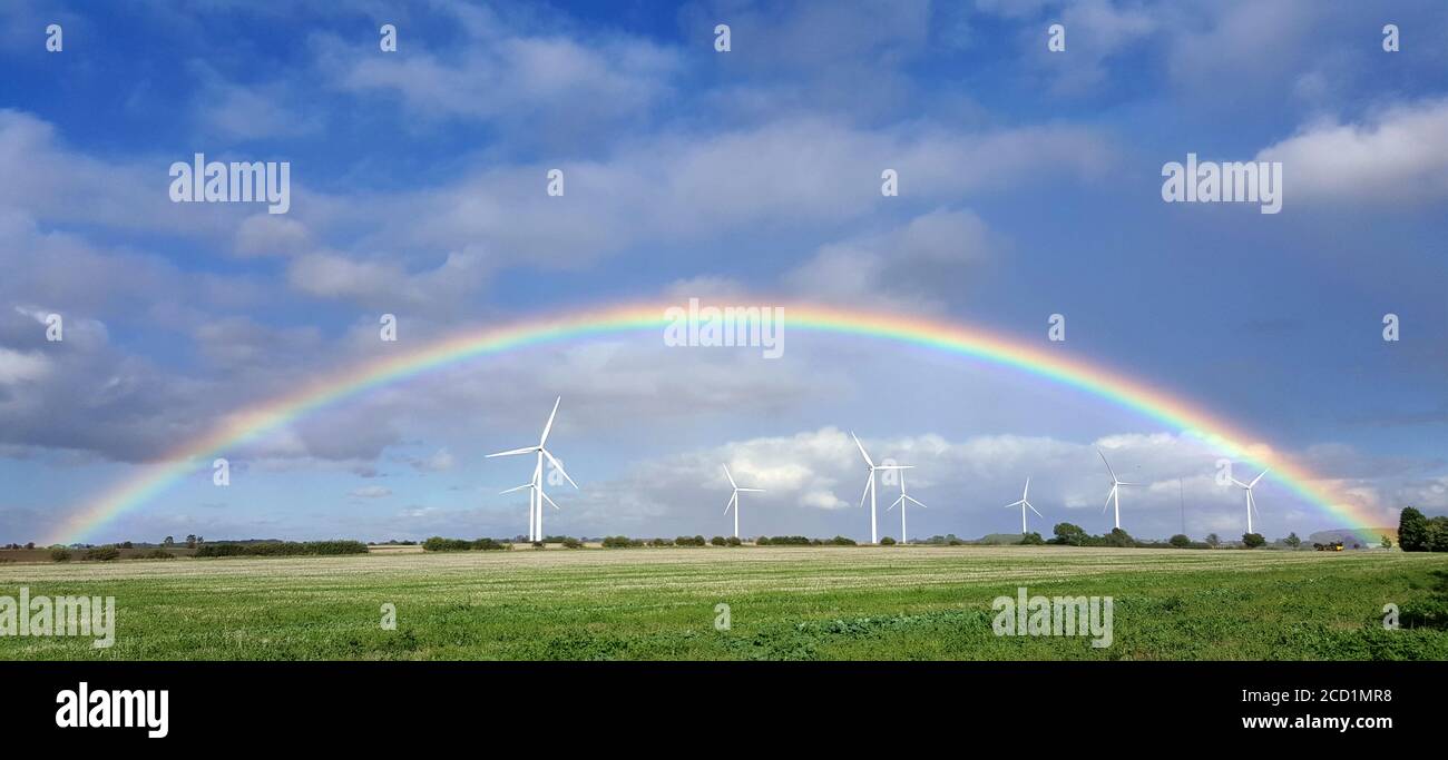 Rainbow over Wind Turbines Stock Photo - Alamy