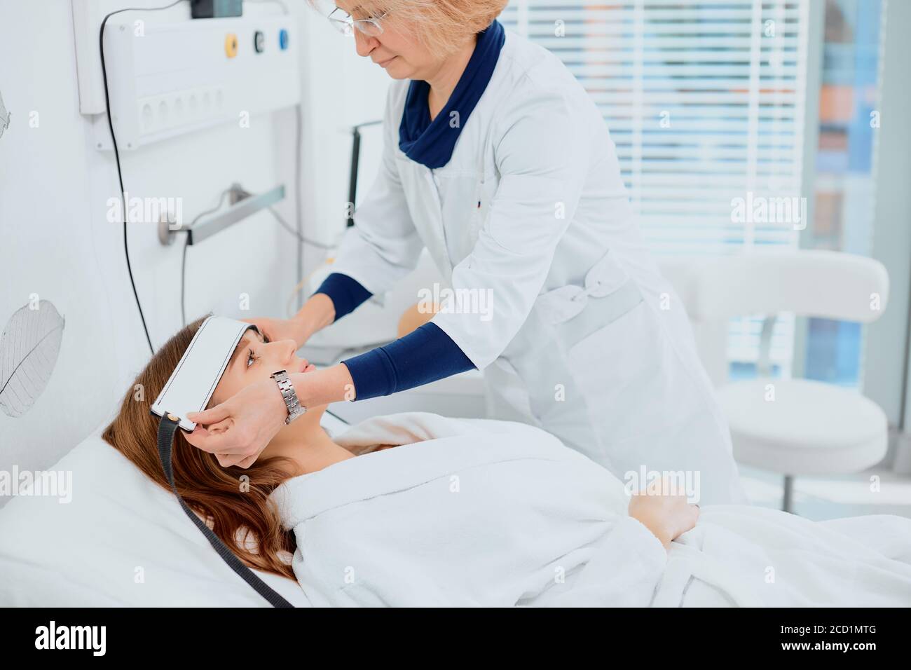 careful female doctor worry about her young patient, take care of her ...