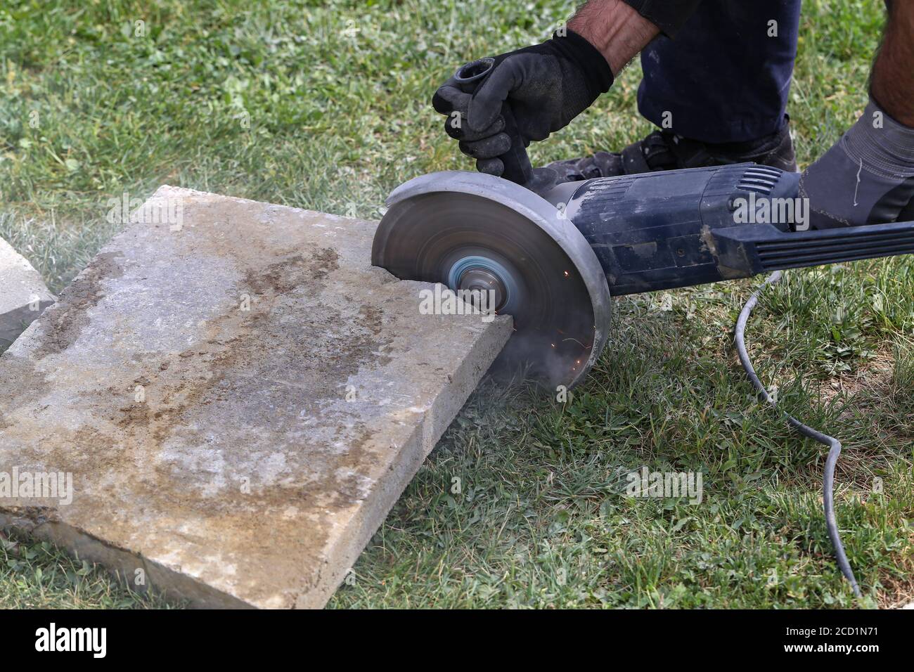Industrial construction worker using a professional angle grinder Stock ...