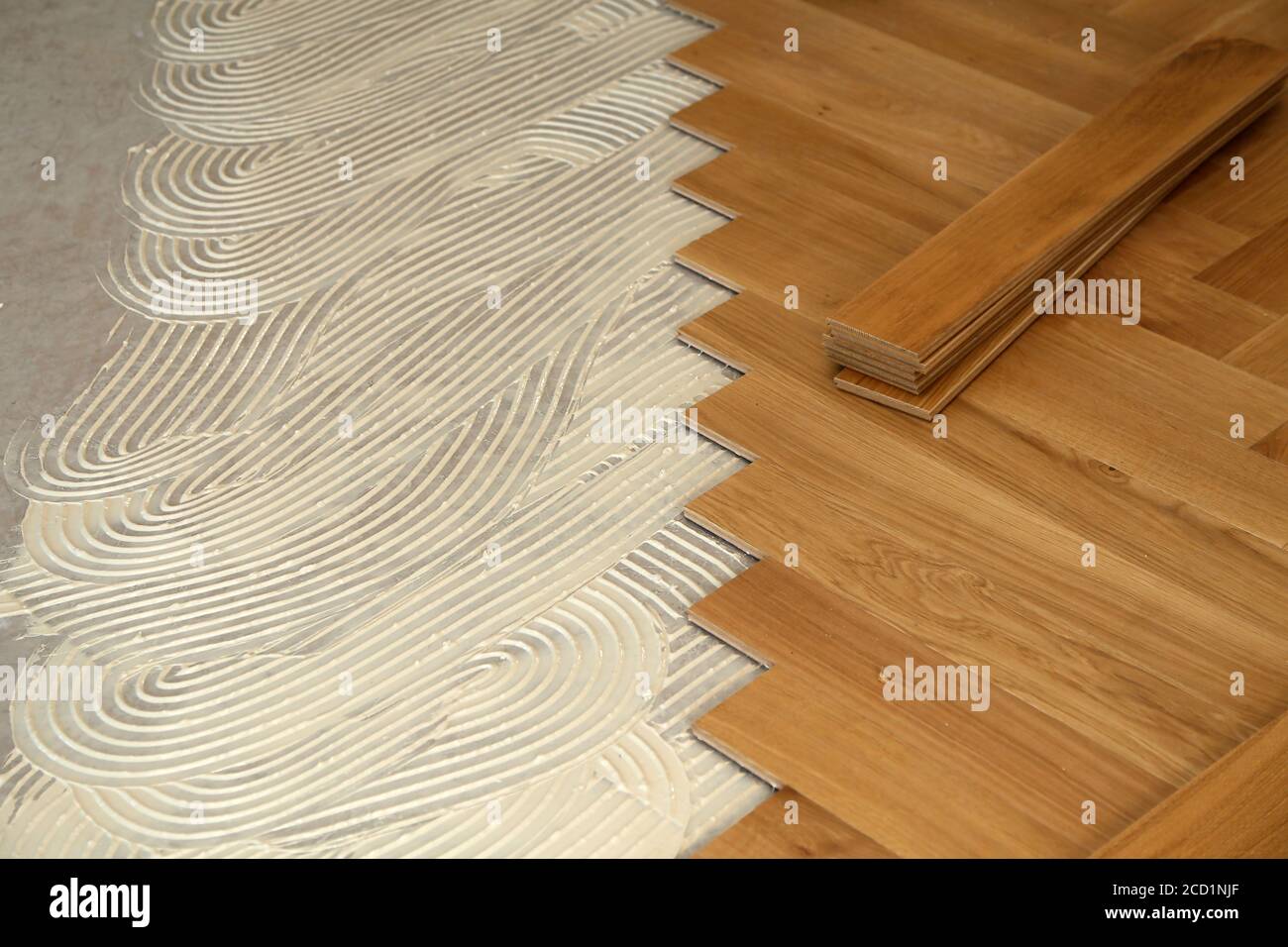 Construction in a renovated room installation of parquet Stock Photo ...