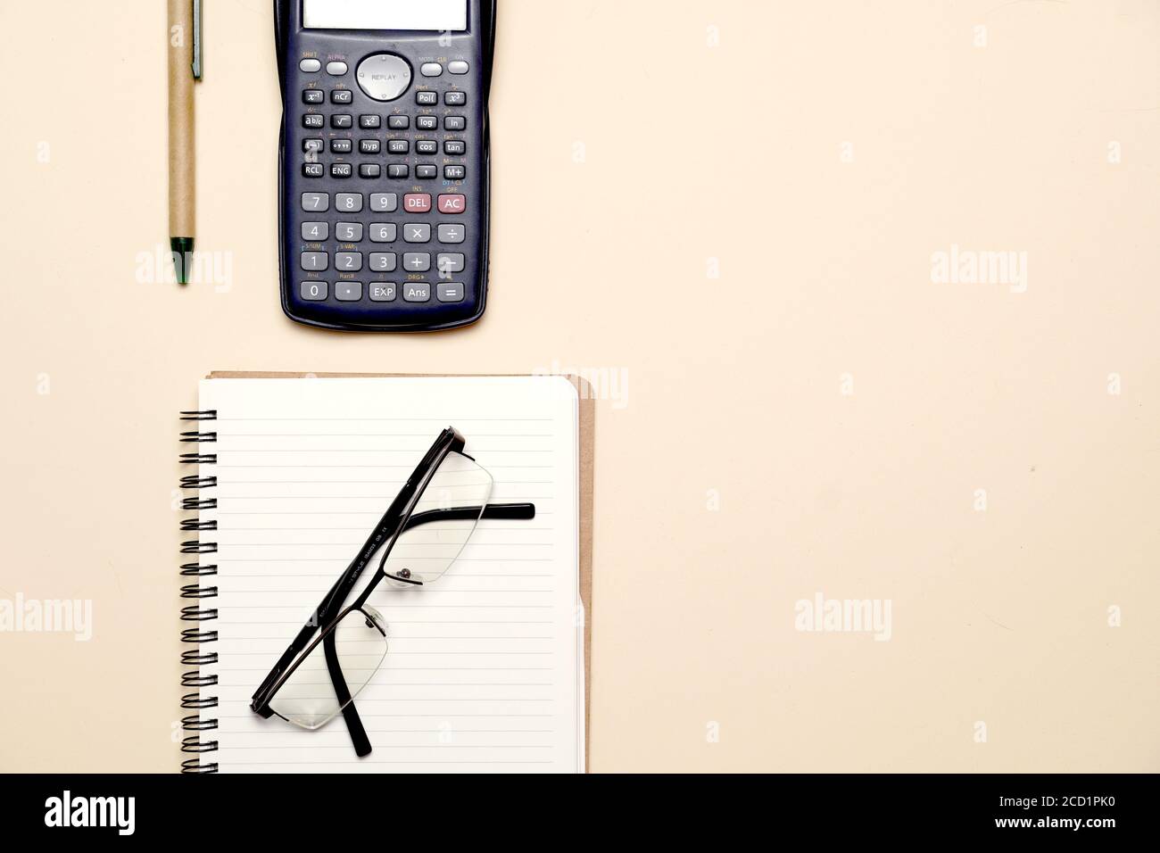 top view of workspace with calculator and pen with copy space. flat lay ...