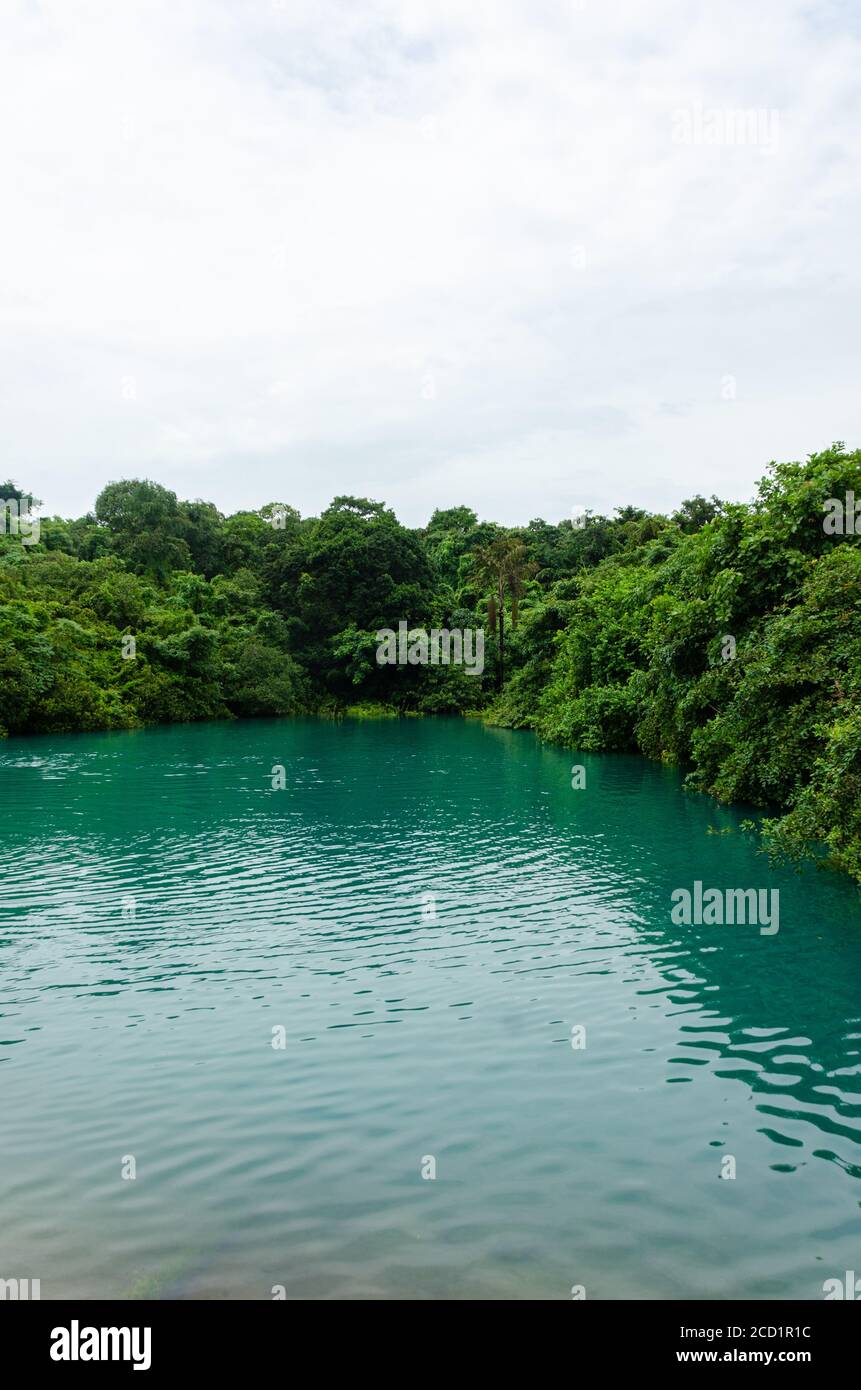 Clean and blue waterbody called Arambol Dam in Arambol, Goa, India ...