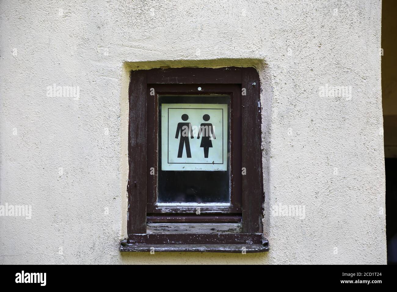 Restroom sign on a small window Stock Photo - Alamy