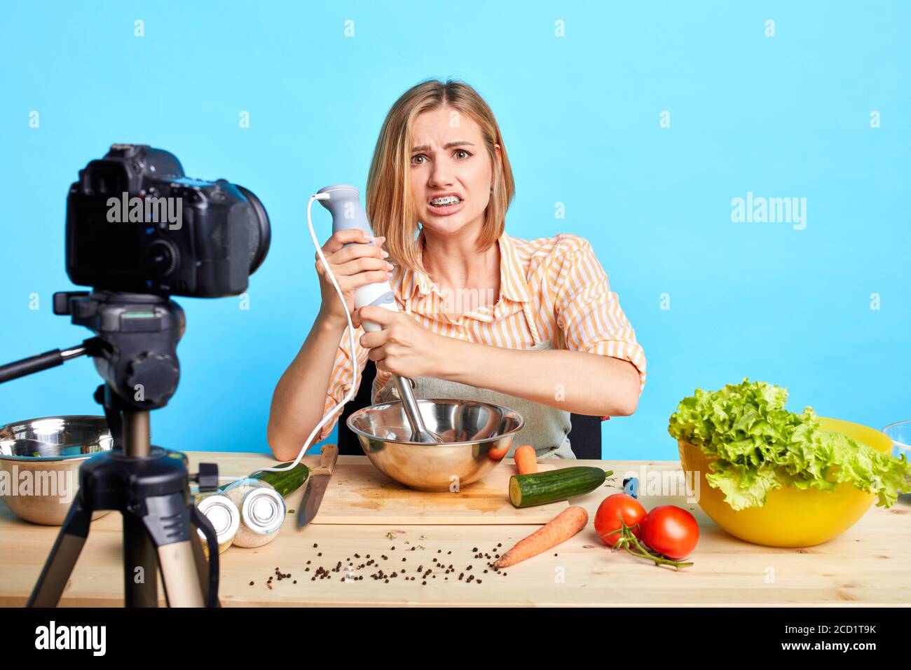 Opps, something goes wrong. Isolated shot of cute blogger girl tries ...