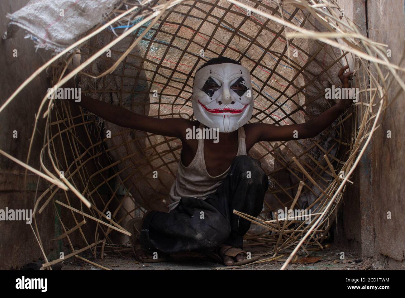 Dhaka, Dhaka, Bangladesh. 25th Aug, 2020. A boy poses for a photo ...