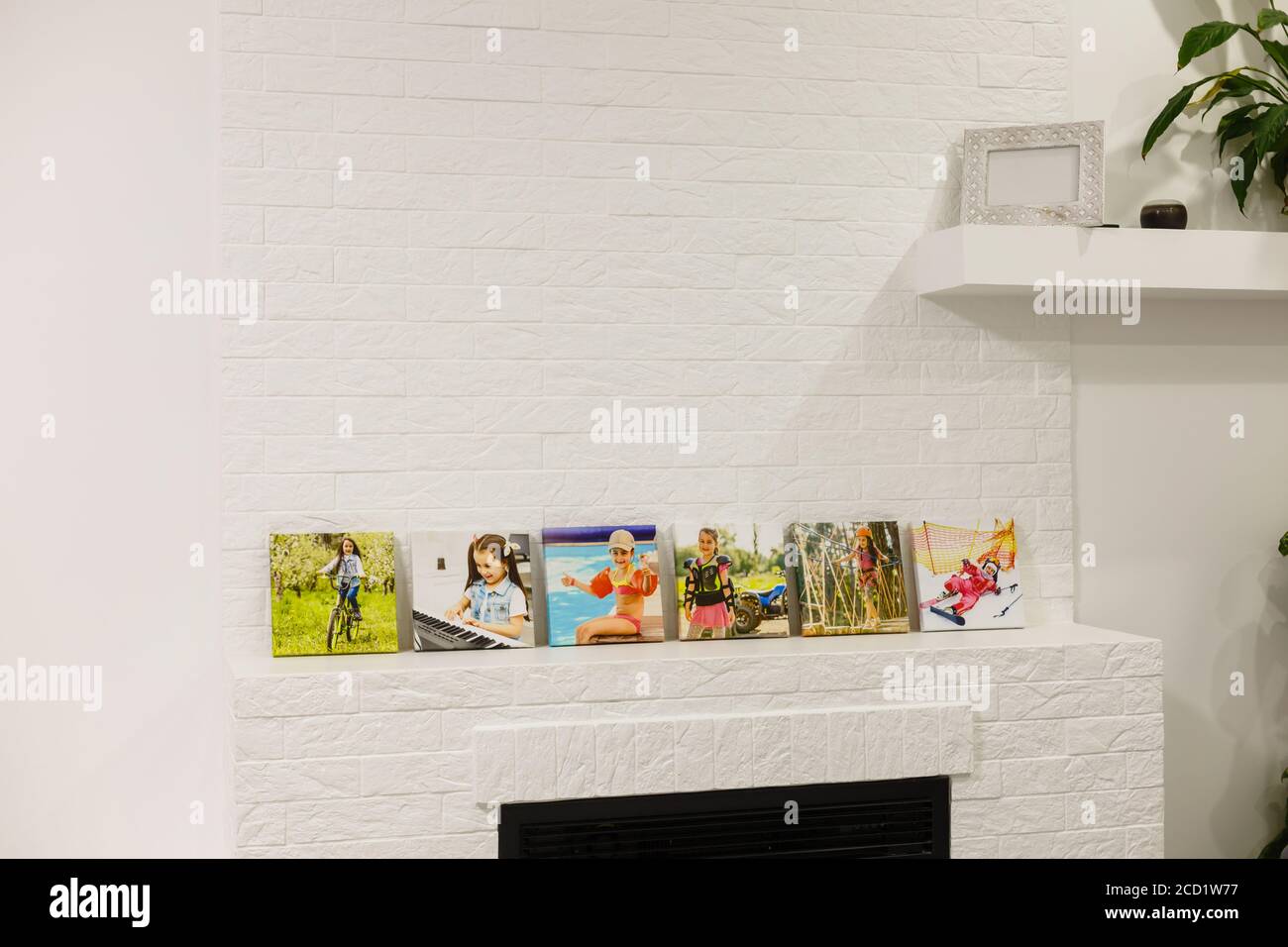 Modern living room interior with canvas on the wall. Photos on canvas ...