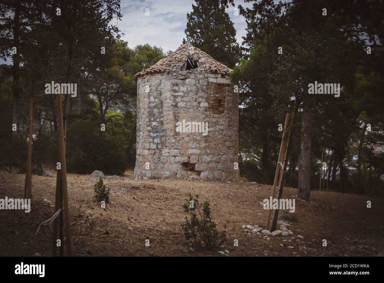 Old, historical, ruined small, stone defence tower with collapsed roof ...