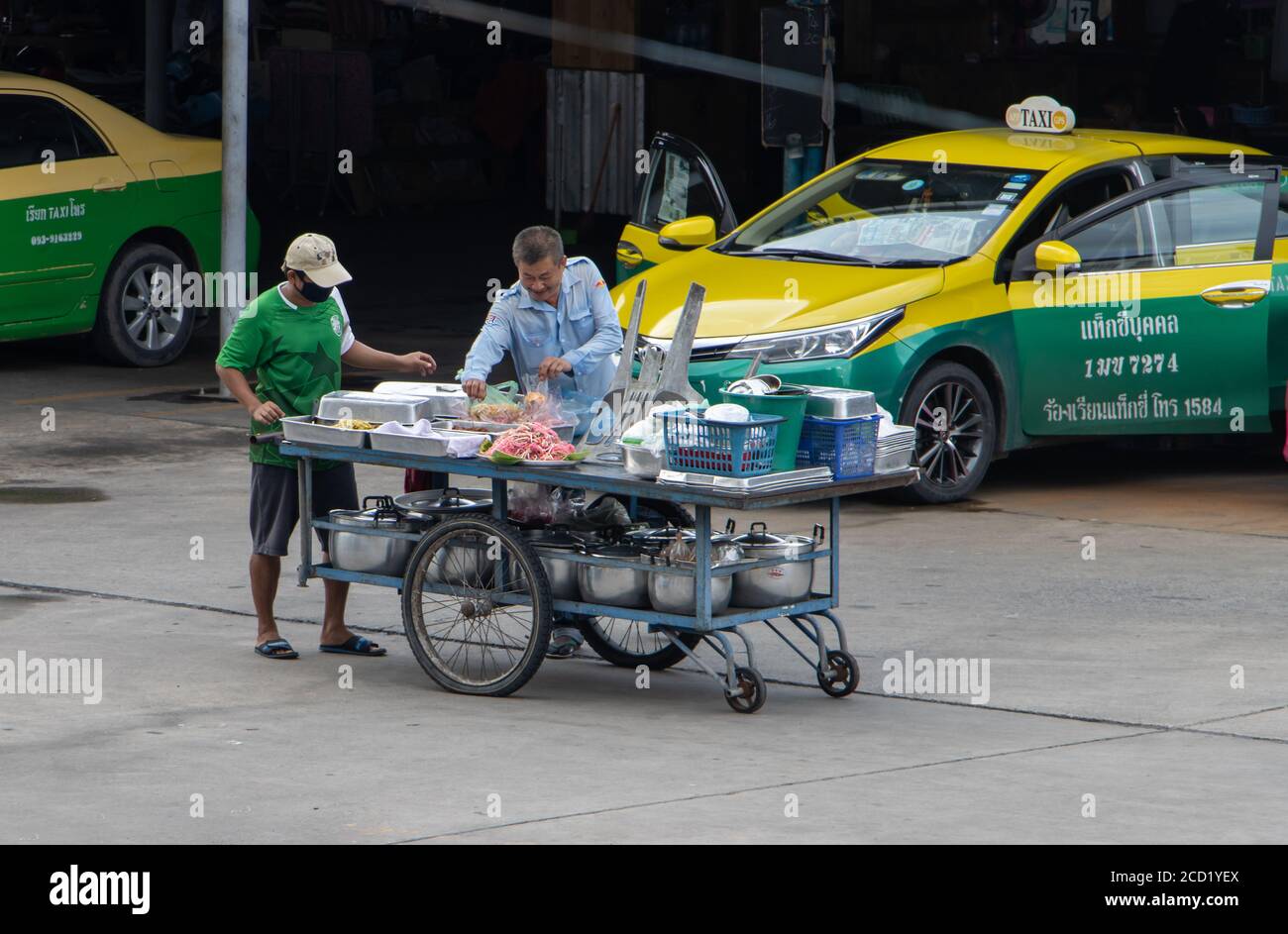 SAMUT PRAKAN, THAILAND, JUN 15 2020, The taxi driver chooses food from ...