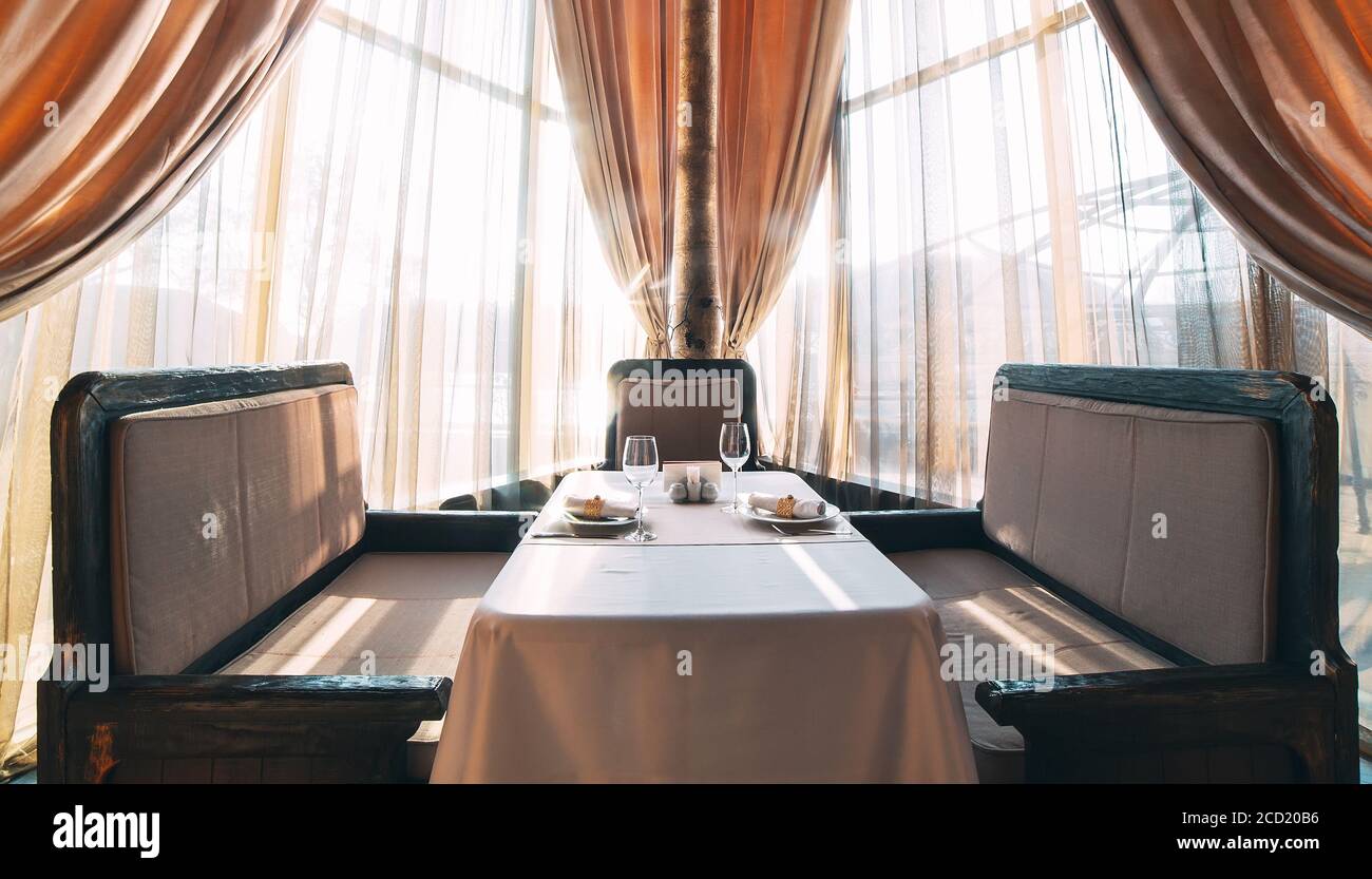Served table for two persons in the restaurant Stock Photo - Alamy