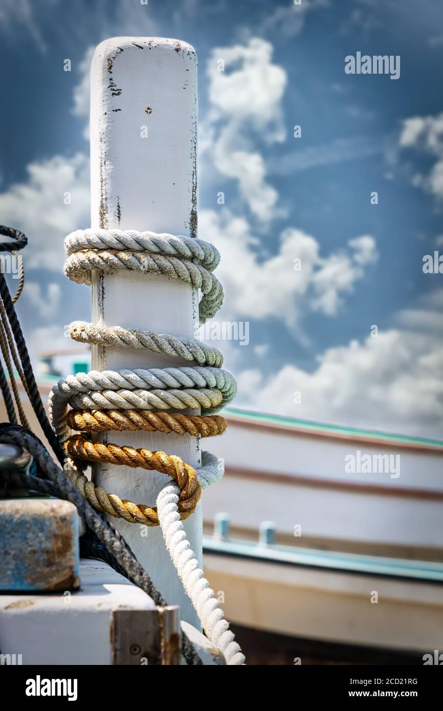 A rope tied to a post on a boat ramp near Yokosuka at the harbor of ...