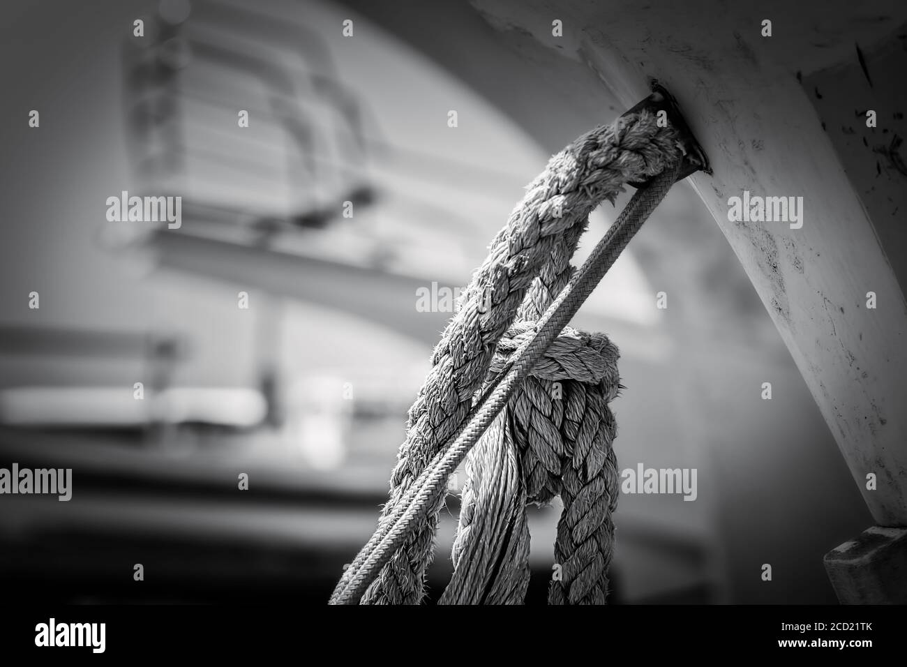 Ropes connected to the hull of a boat sitting on a ramp near Yokosuka ...