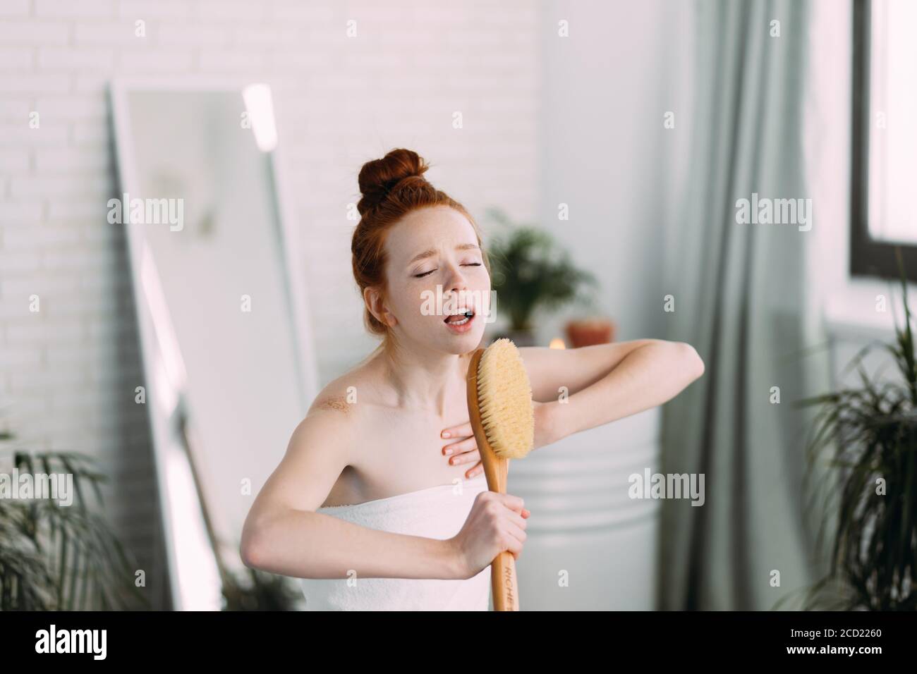 Joyful Beautiful Caucasian Woman With Redhead Hair Knot Wrapped In Bath