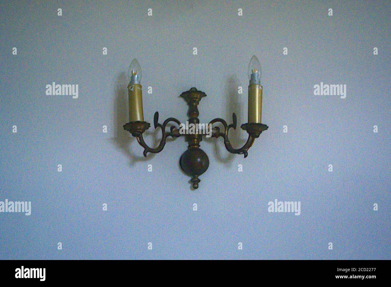 A double electric light attached to a wall Stock Photo - Alamy