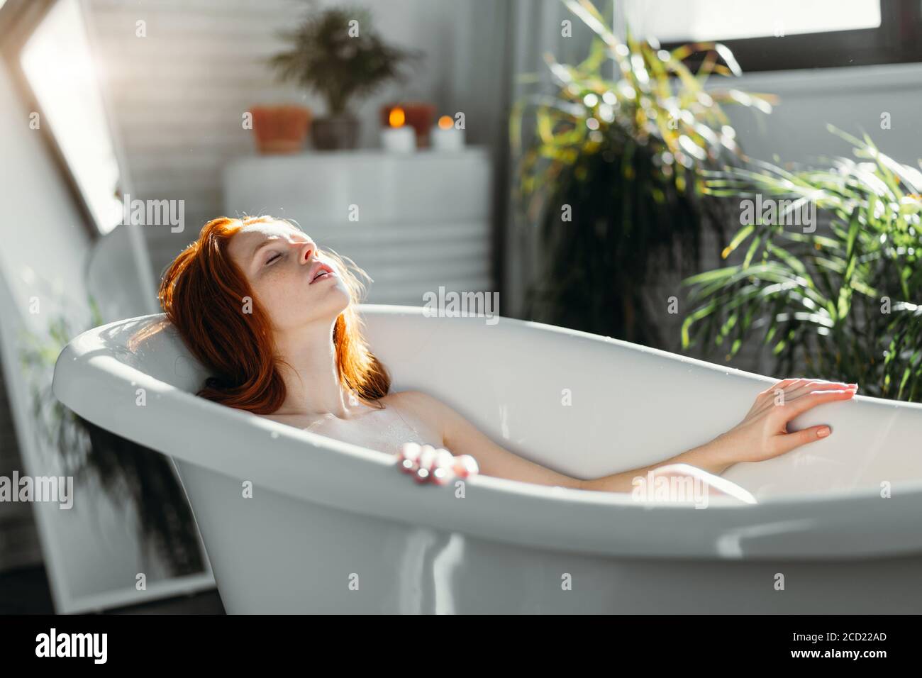 Woman taking a bubble bath hi-res stock photography and images - Alamy