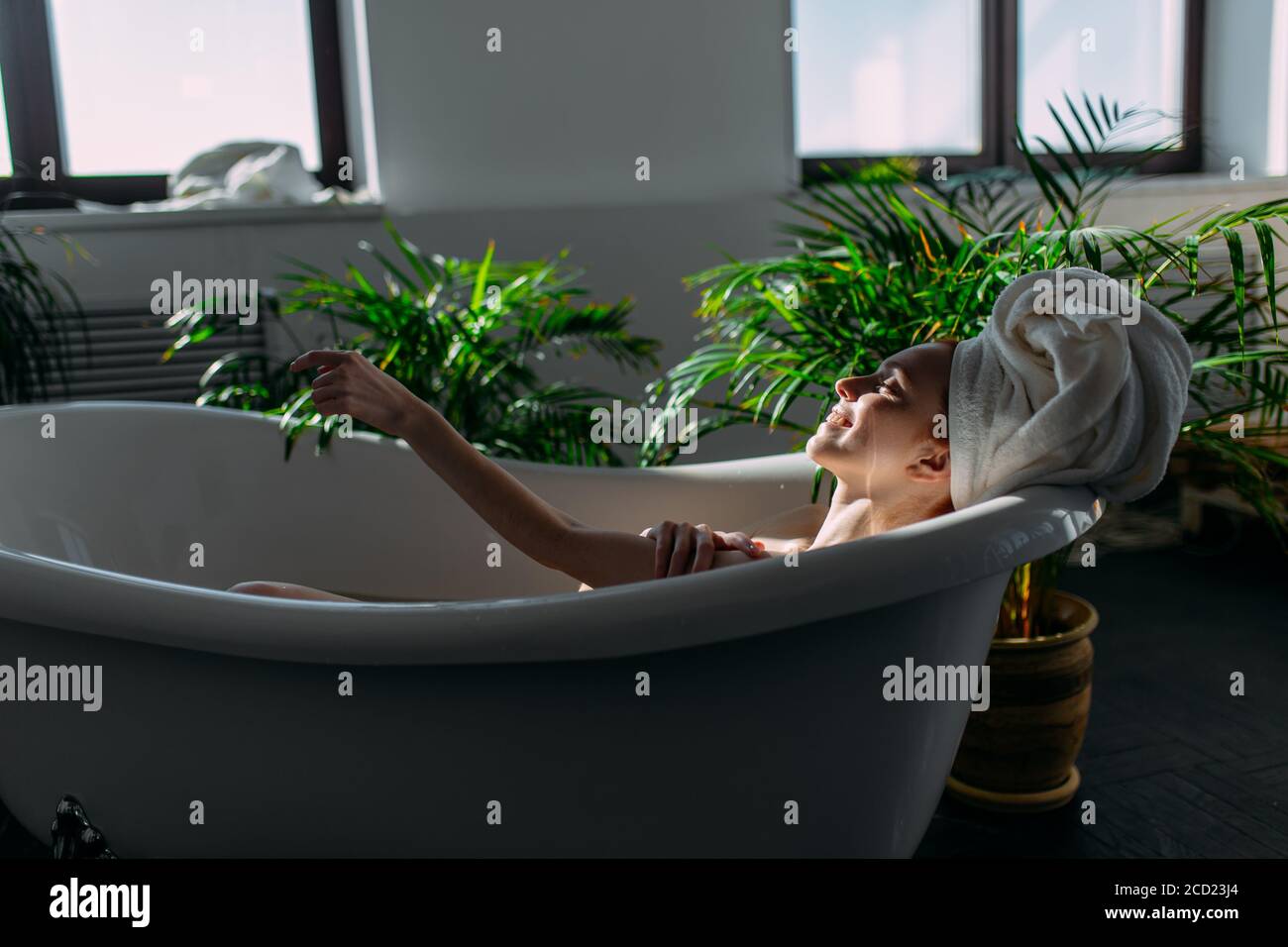 Old woman taking bath in hi-res stock photography and images - Alamy