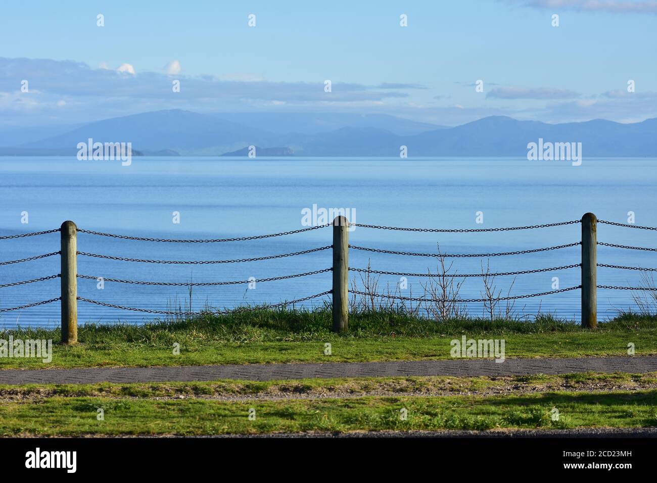 Cold morning scenery of large lake with mountain range in background ...