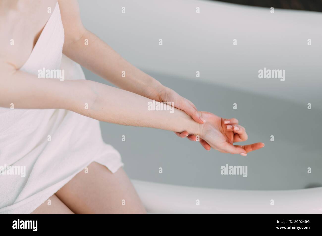 Morning routine of redhead beauty in the bathroom. Woman running bath ...