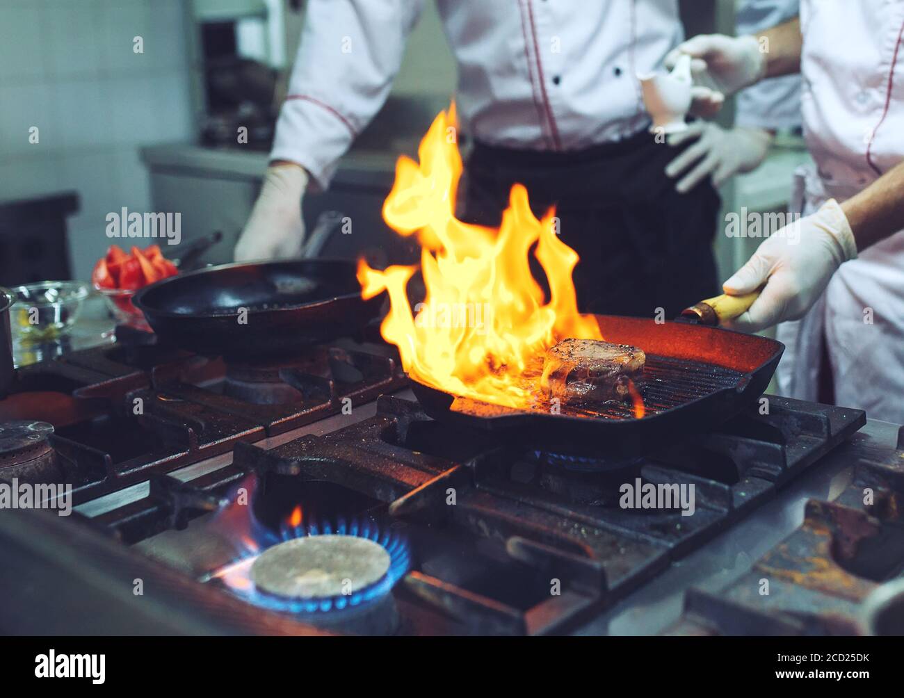 Fire in the kitchen. Fire gas burn is cooking on iron pan,stir fire ...