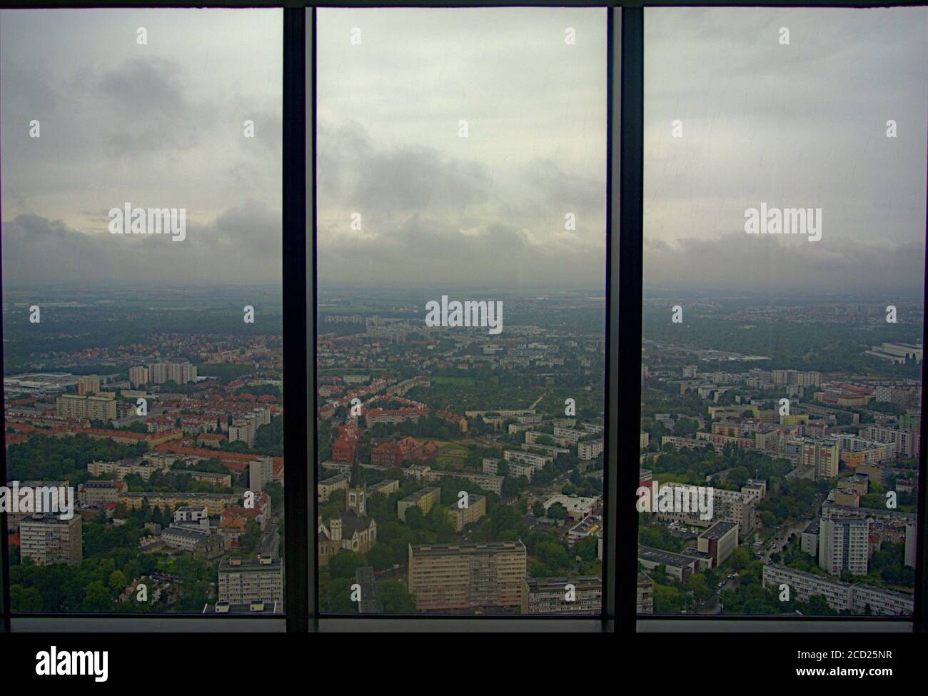 A look at the cityscape view of Wroclaw through multiple window panes ...