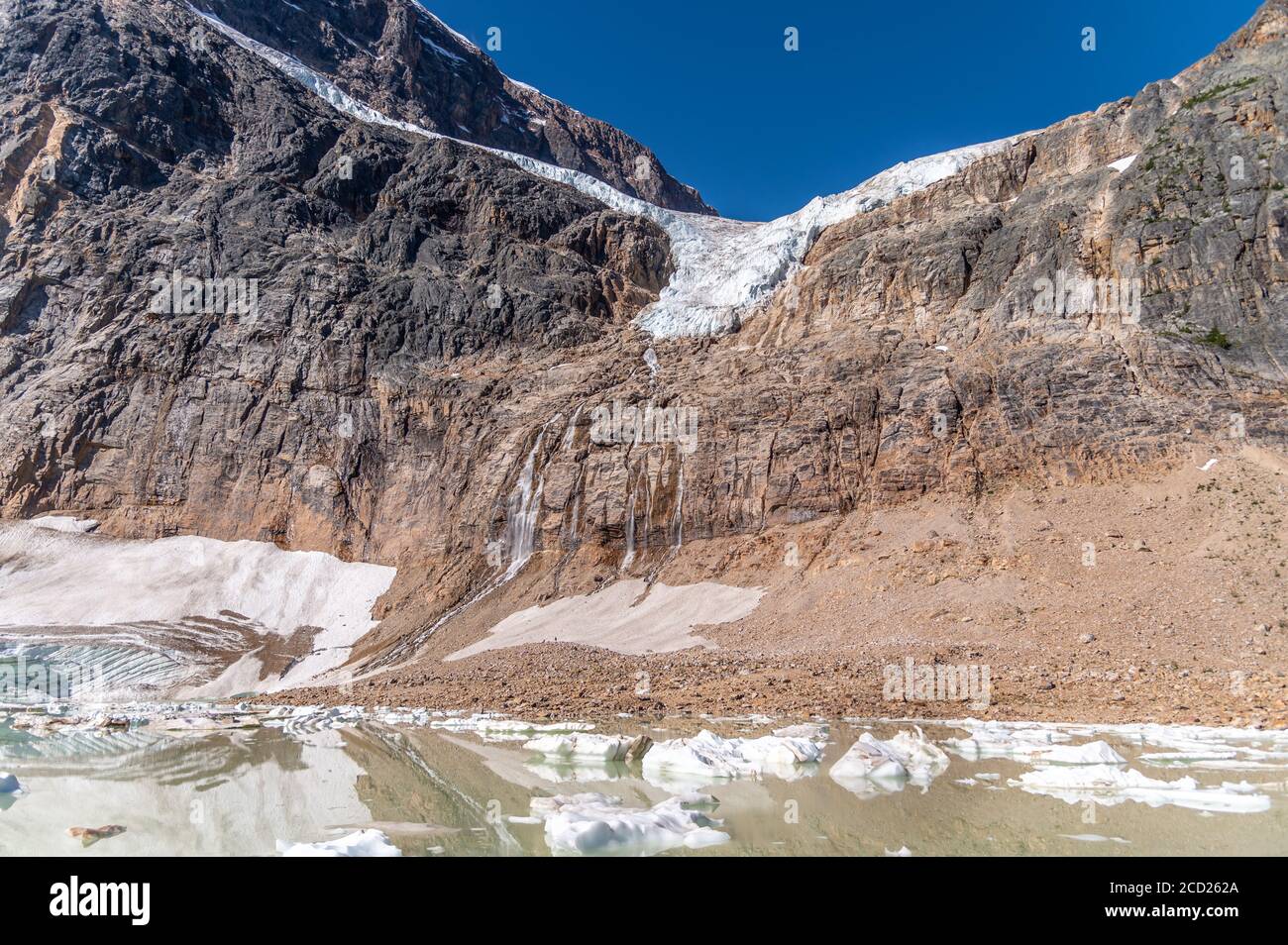 Angel Glacier hangs over a cliff below Mount Edith Cavell in Jasper ...