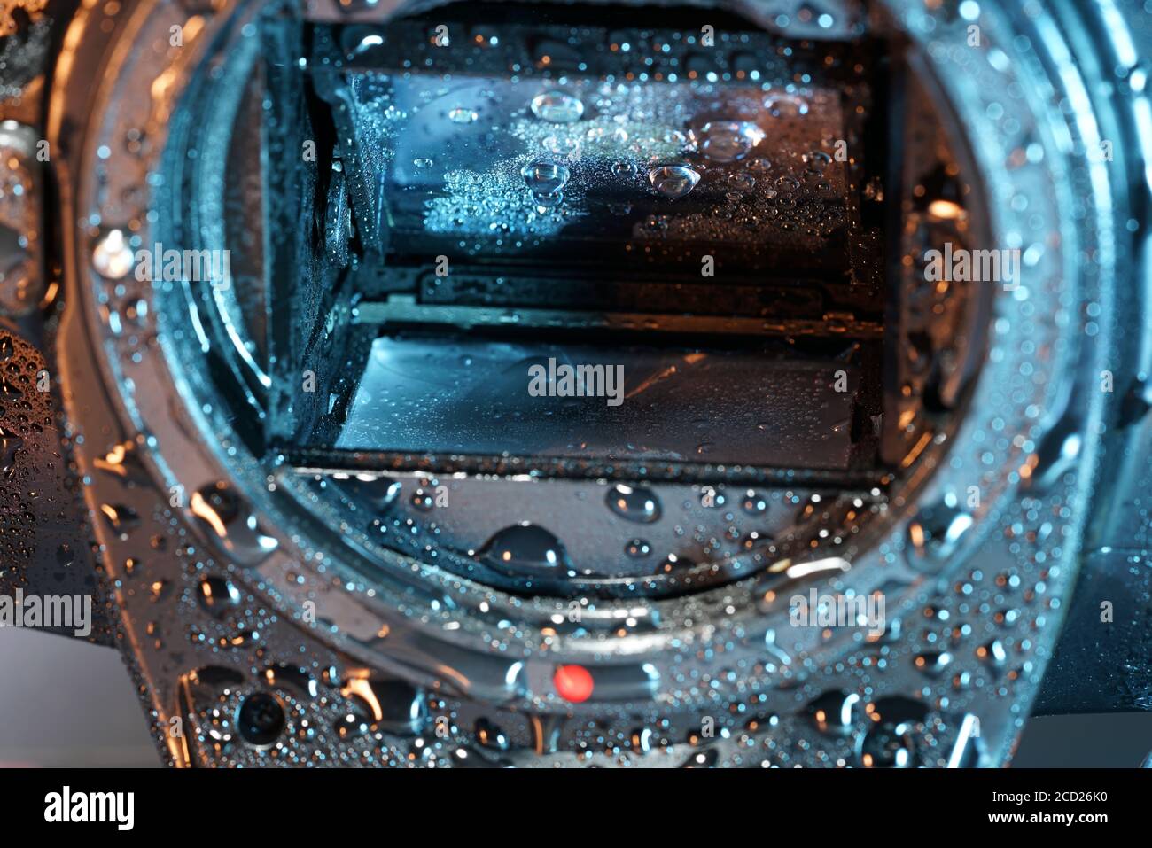 Closeup shot of a mirror box of a camera covered by water drops Stock ...