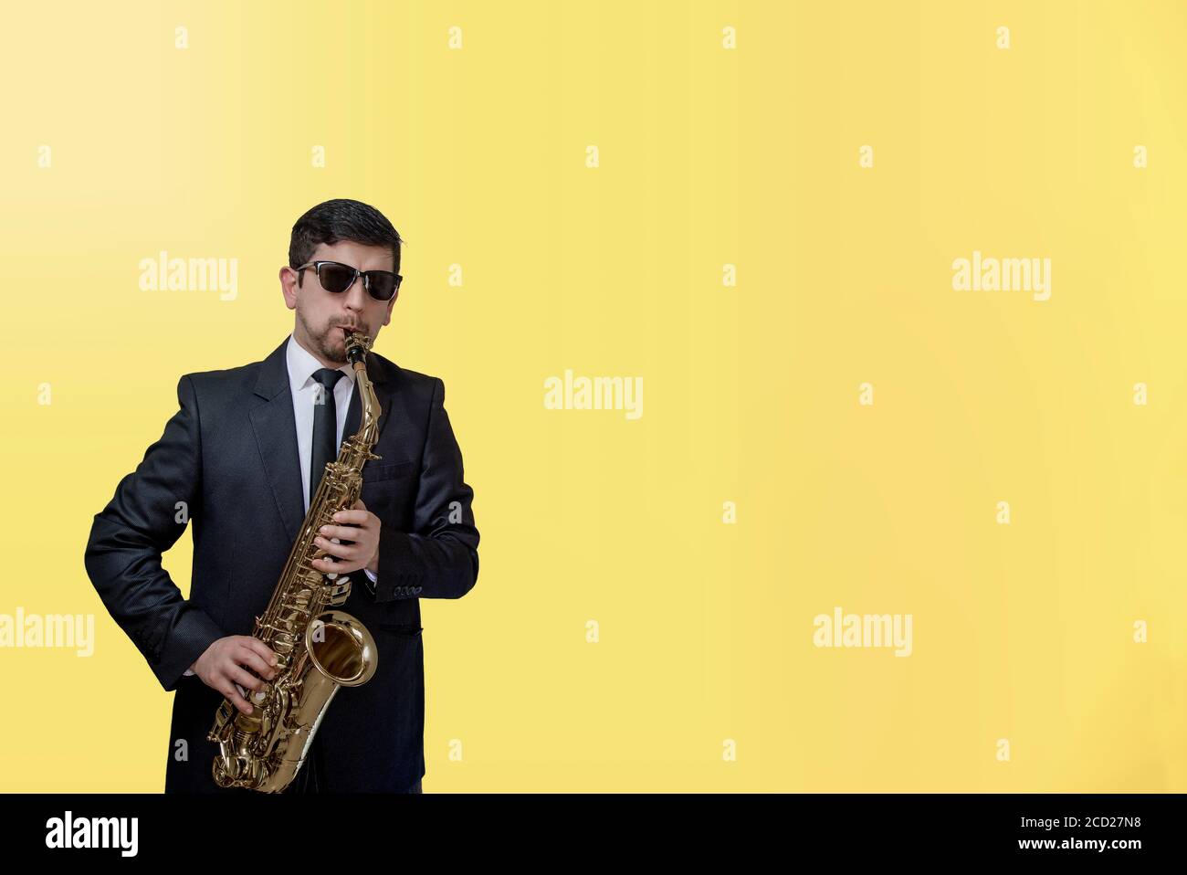 Man playing saxo Stock Photo - Alamy