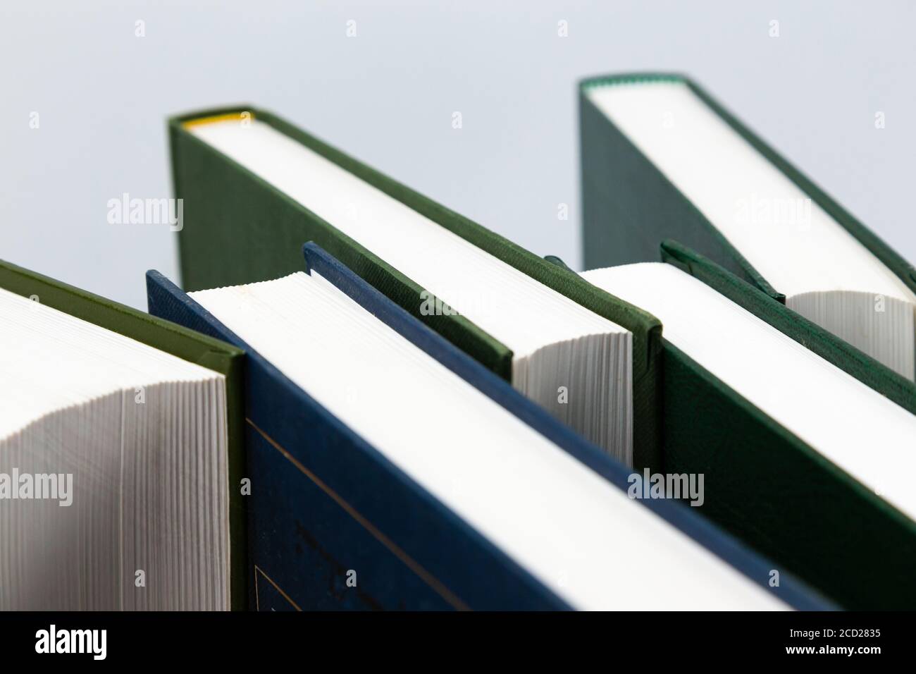Stacked Books side view Isolated On White Background Stock Photo - Alamy