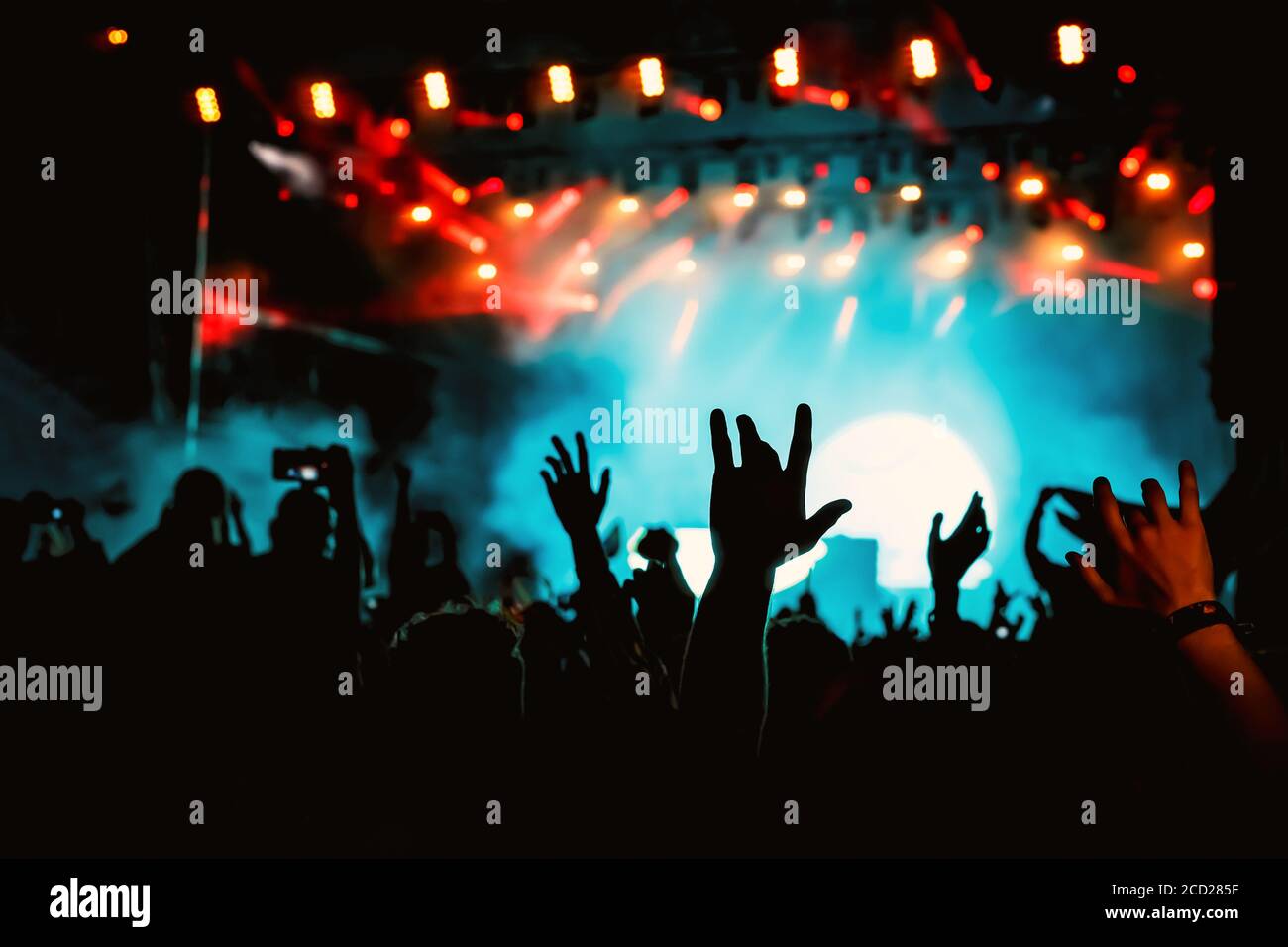 A lot of hands, crowd on concert, blue light Stock Photo - Alamy