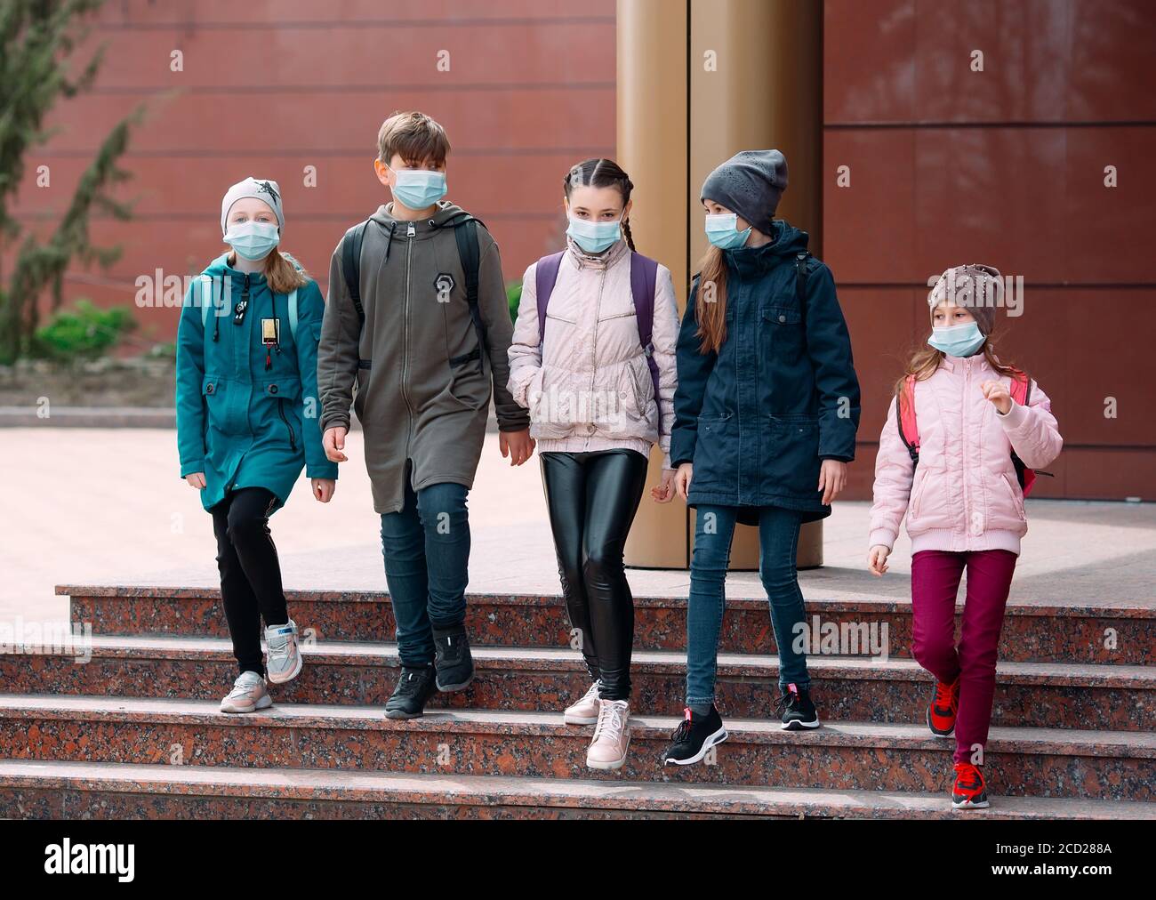 Group schoolchildren in medical masks hi-res stock photography and ...