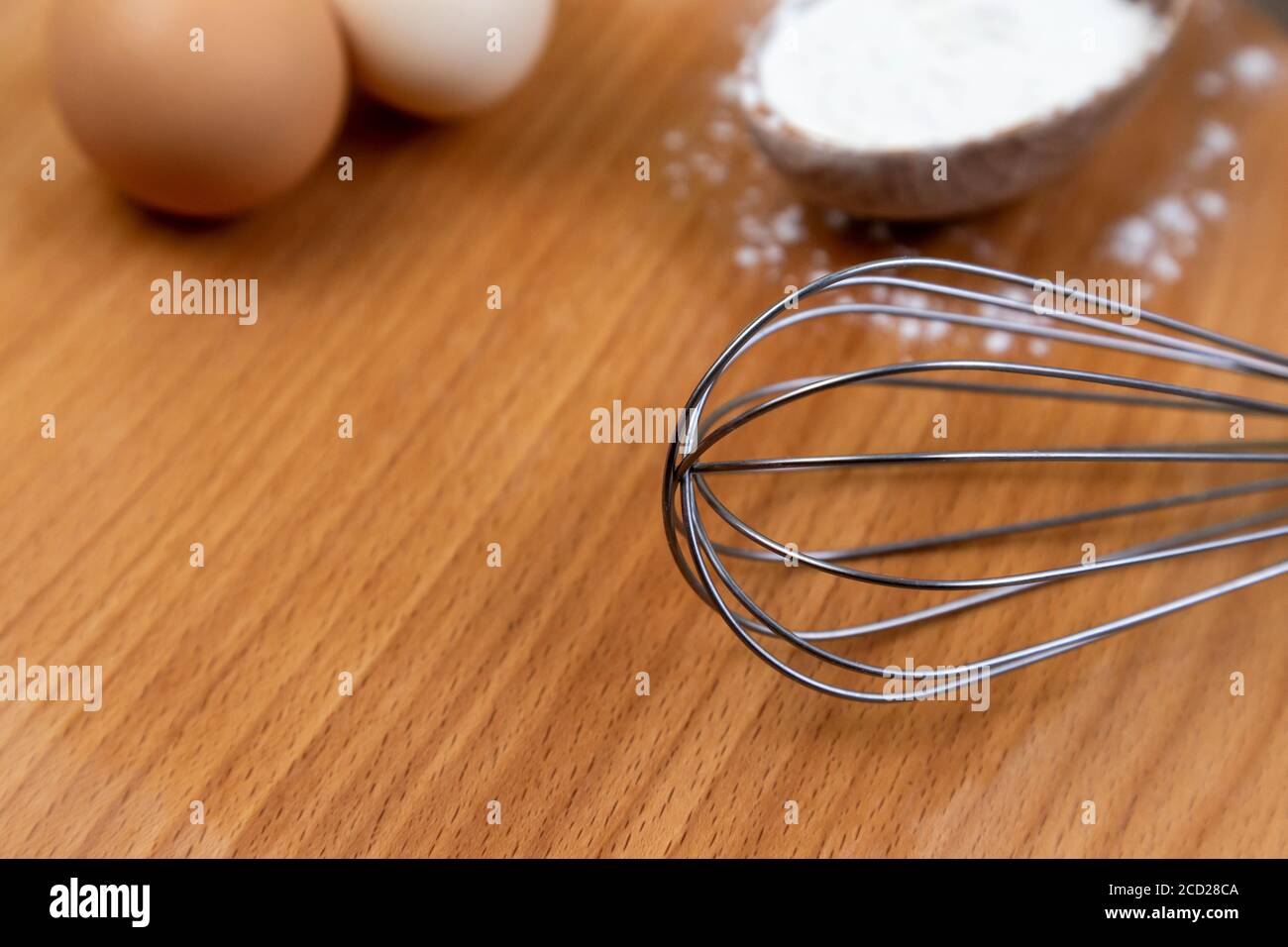 Cooking ingredients and kitchen tools on wood table. Close up Stock ...