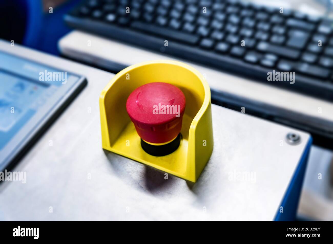 Red emergency button on black panel. Stop Stock Photo - Alamy