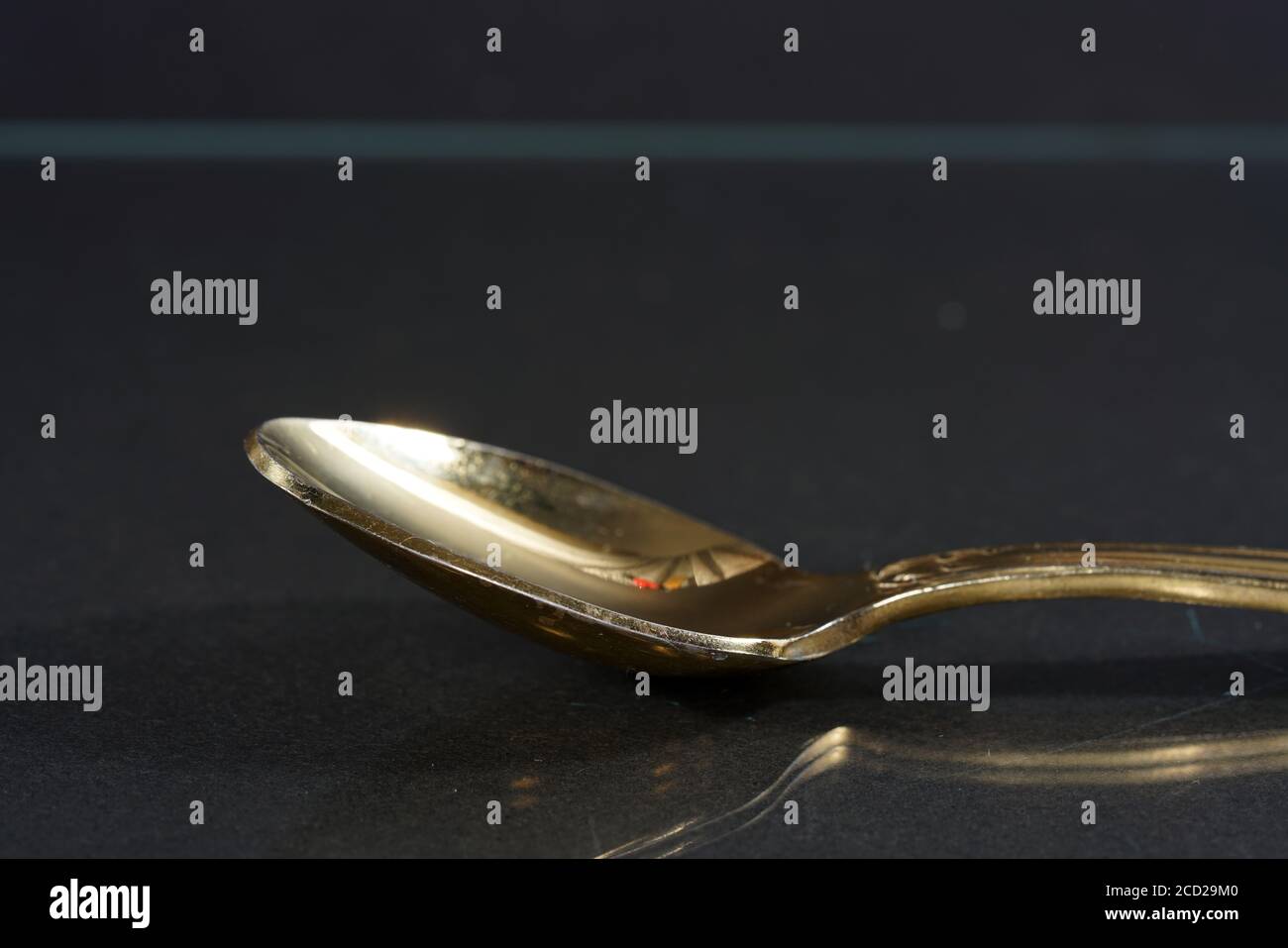 Reflective spoons hi-res stock photography and images - Alamy