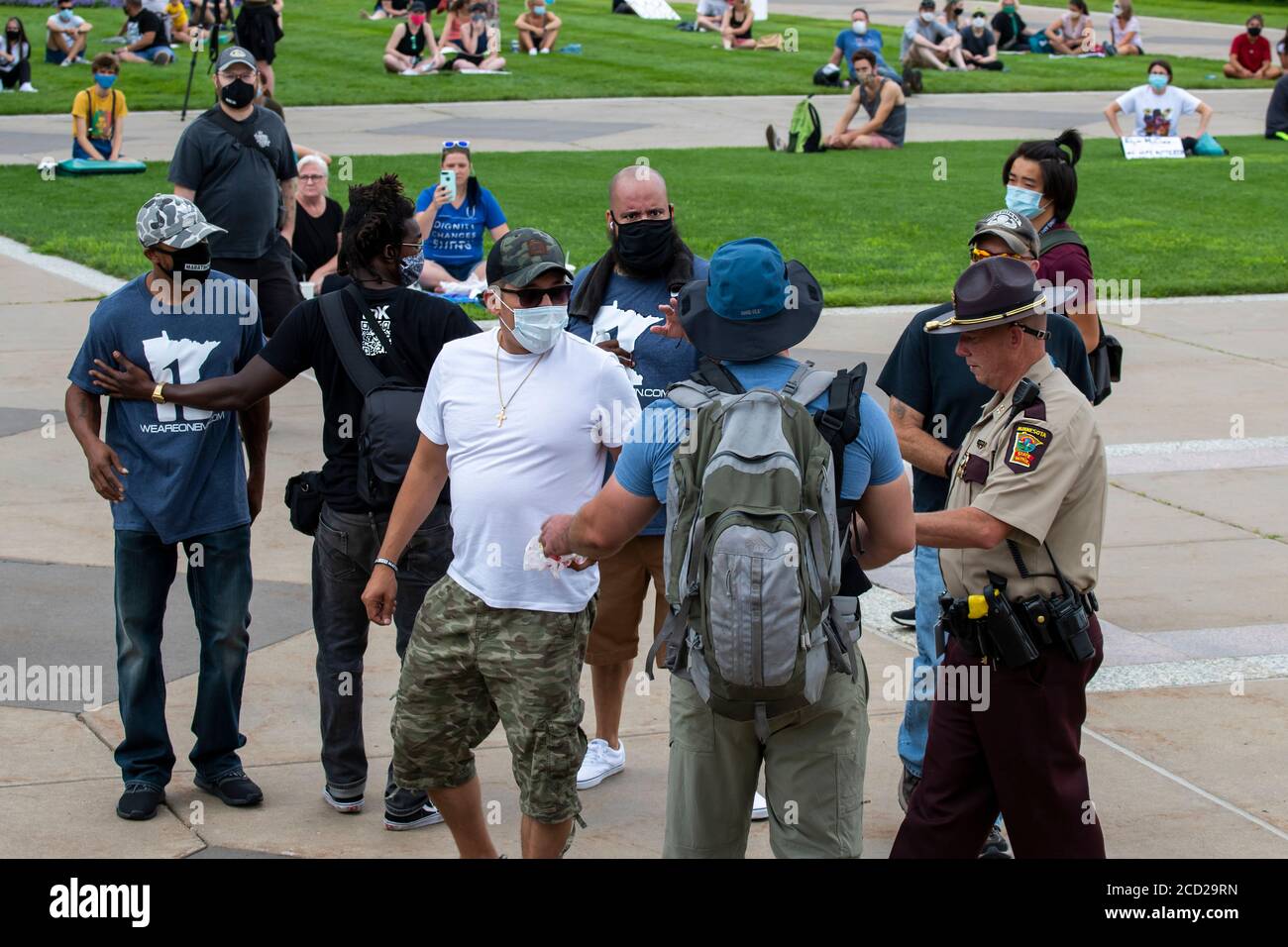 Police and a protester argue hi-res stock photography and images - Alamy