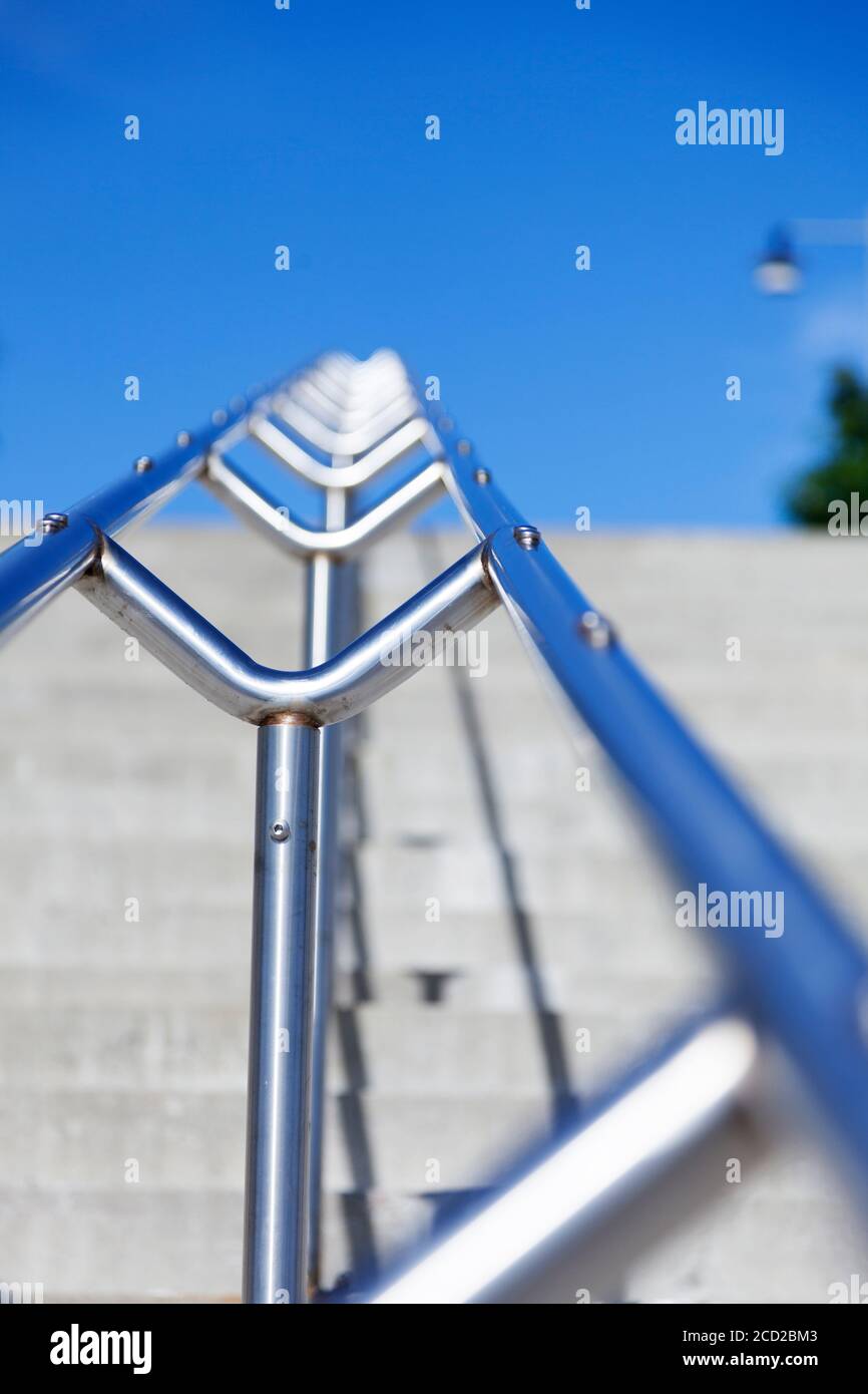 metal handle for a long staircase Stock Photo - Alamy