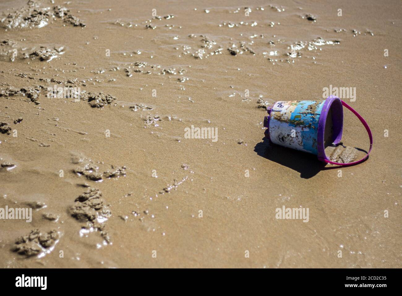 Closeup shot of a bucket on the sand Stock Photo - Alamy