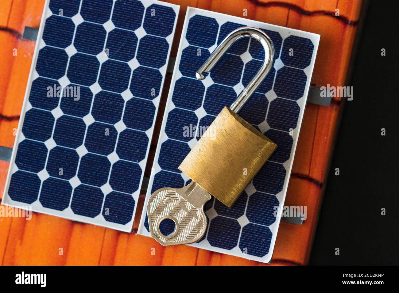 Padlock with key on photovoltaic solar panel on black background Stock ...