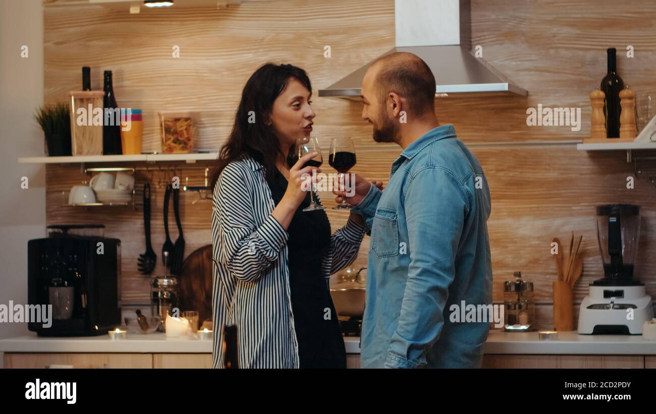 Young caucasian couple flirting during festive dinner with table in ...