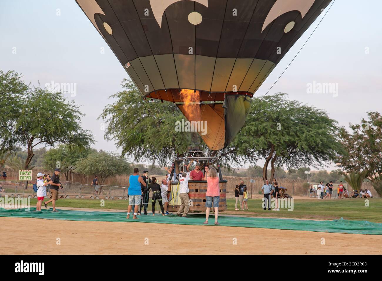 Ground crew preparing a hot air balloon before takeoff Stock Photo - Alamy