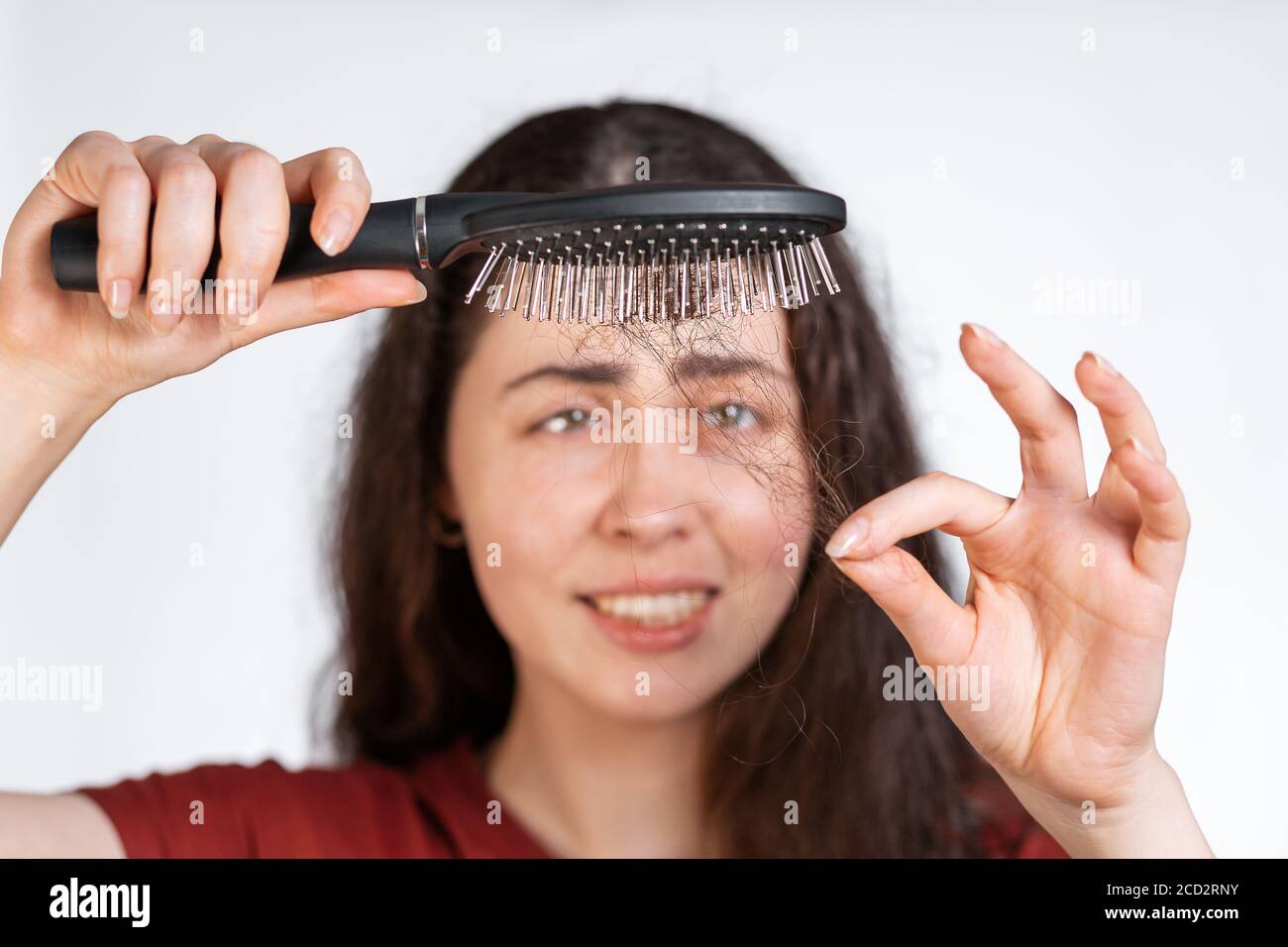 Hand holds hairbrush hi-res stock photography and images - Alamy