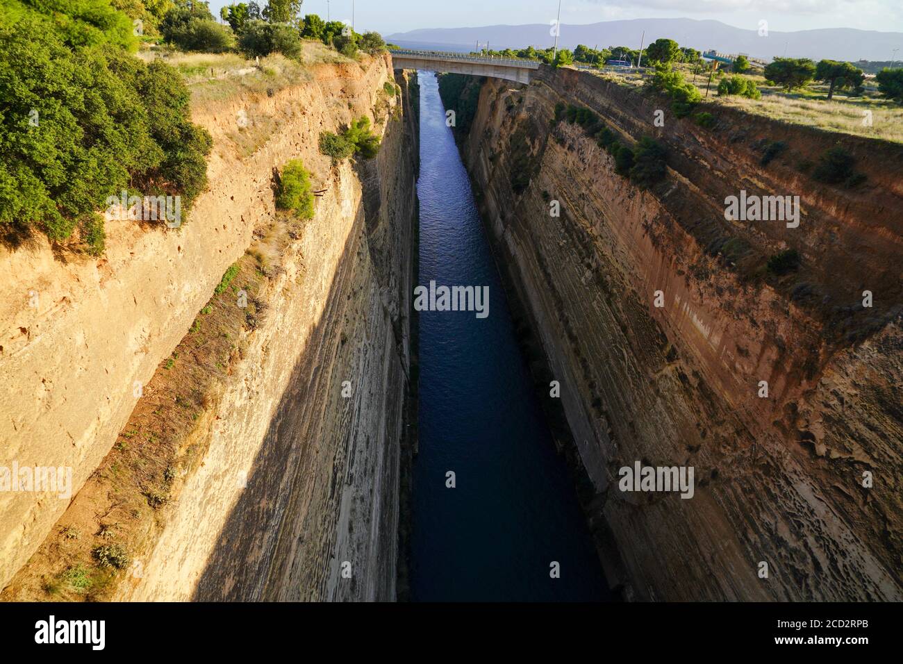 The Corinth Canal connects the Gulf of Corinth in the Ionian Sea with ...