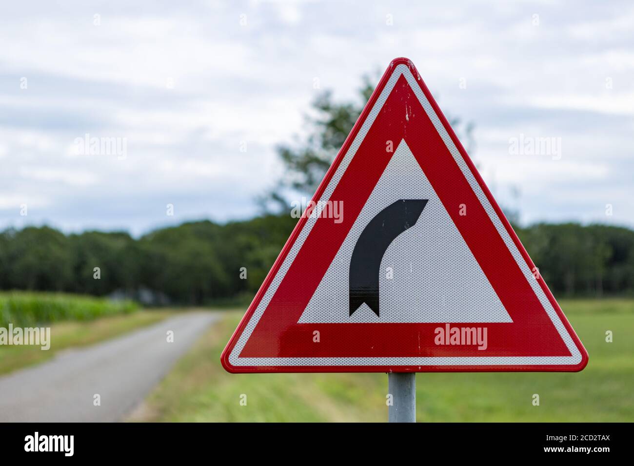 Caution dangerous corner sign hi-res stock photography and images - Alamy